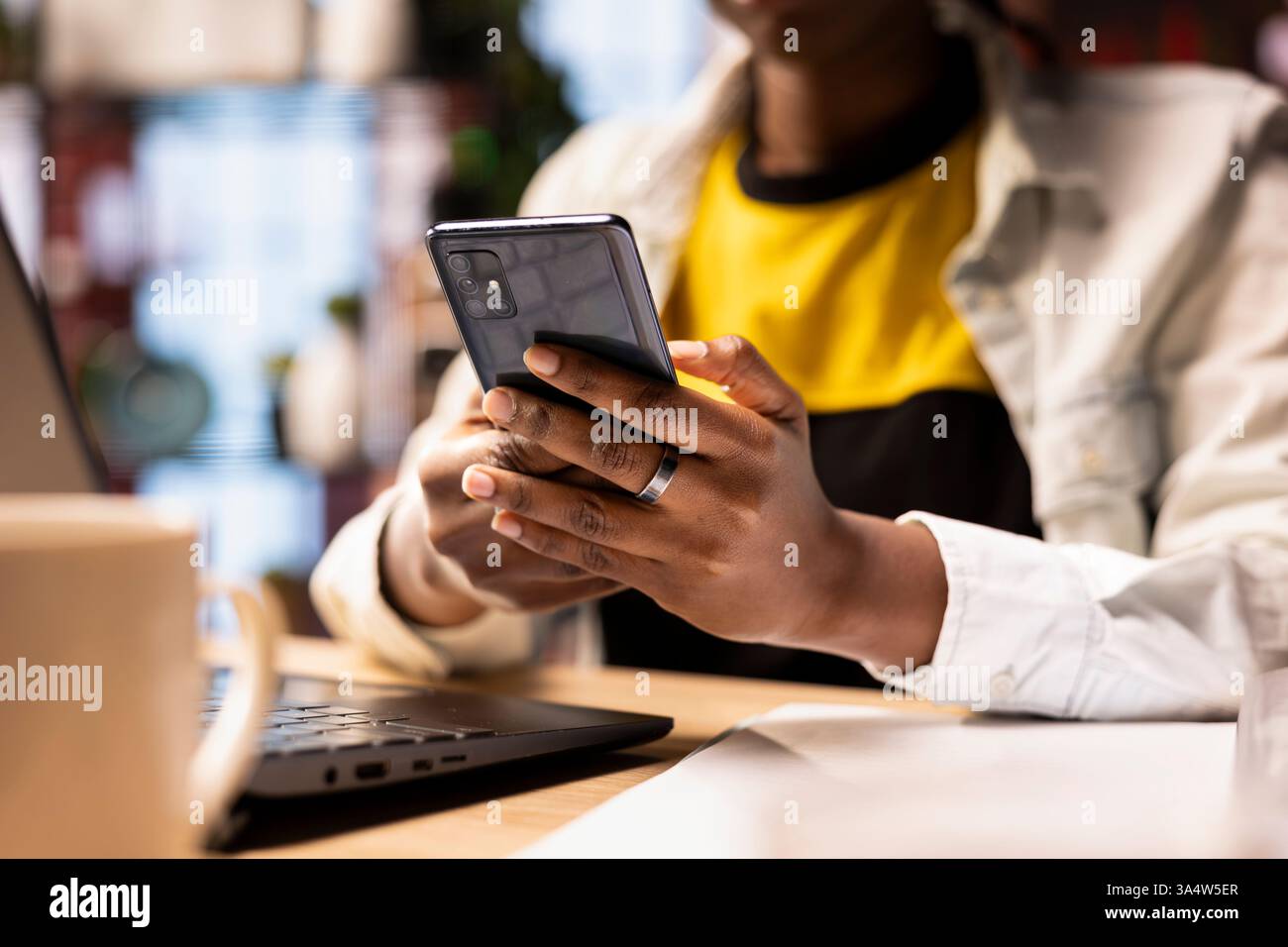 Woman at home browsing internet, typing on phone touchscreen ...