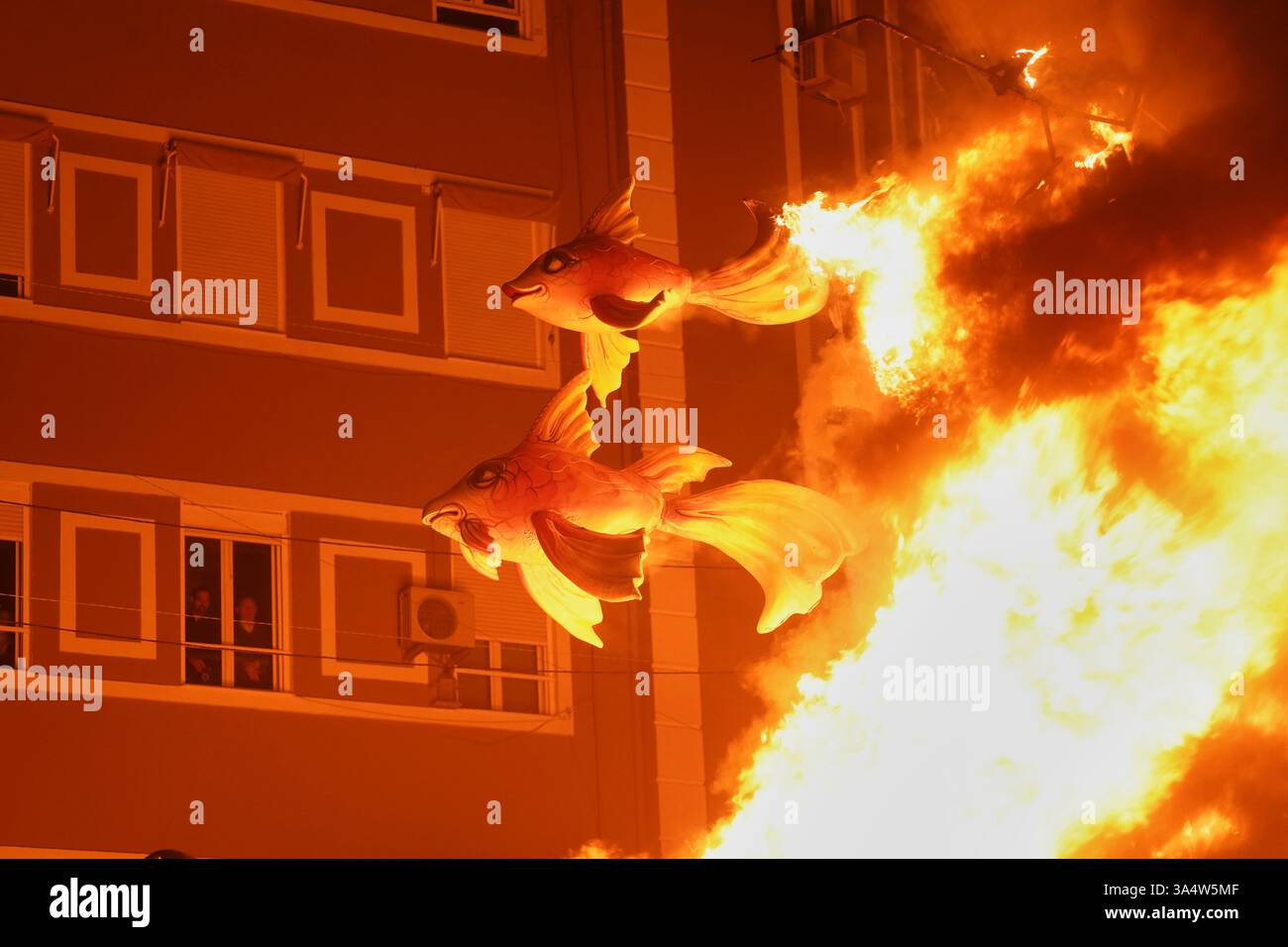 Cardboard sculptures known as "Ninots" burn during the Fallas festival ...