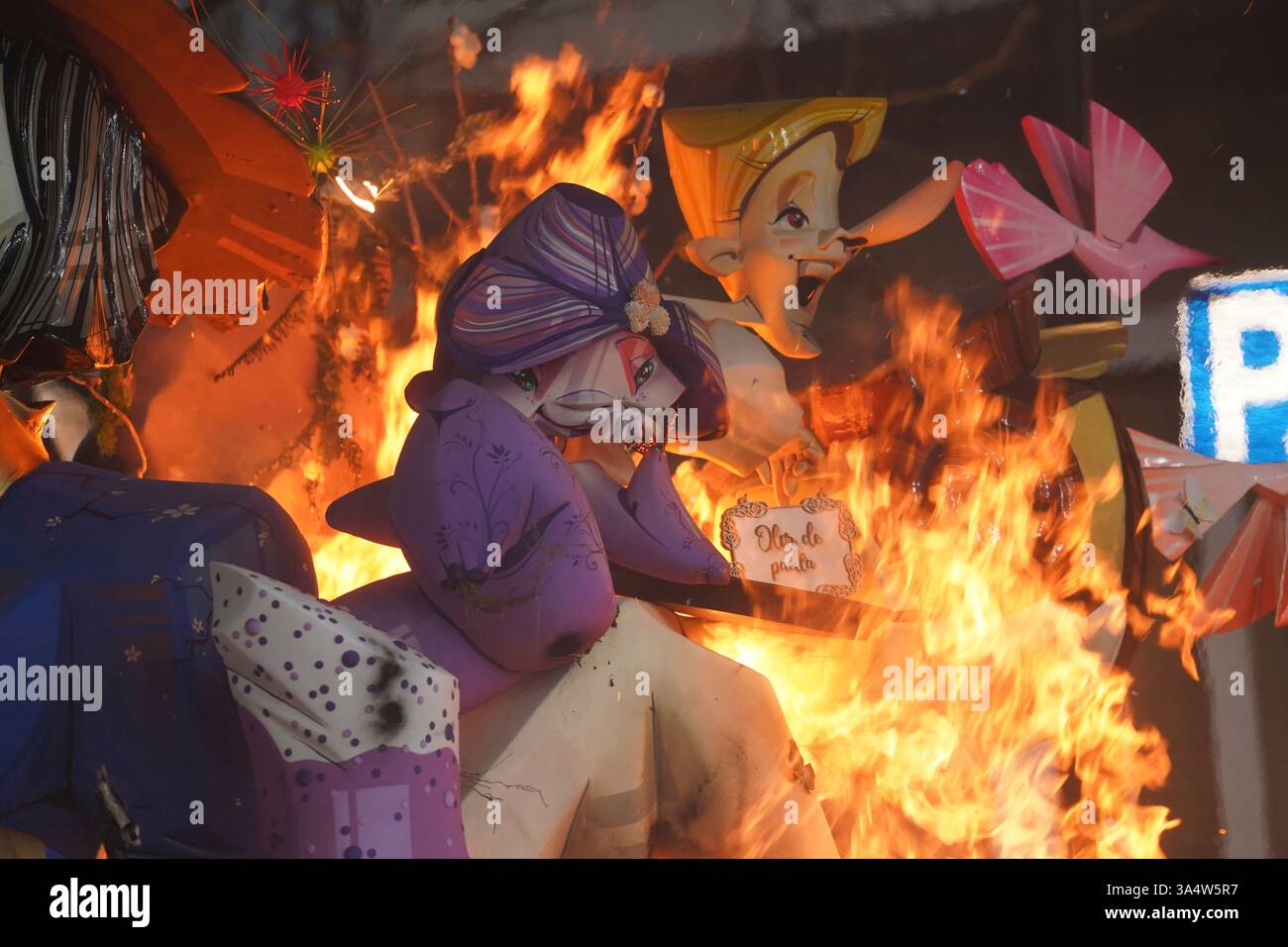 Cardboard sculptures known as "Ninots" burn during the Fallas festival ...