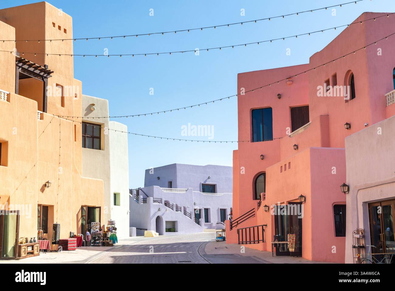 Colorful Mina village district street with arab traditional shaped ...