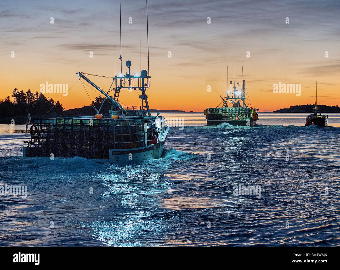 Boats loaded with traps head from the harbour in West Dover, N.S. on ...