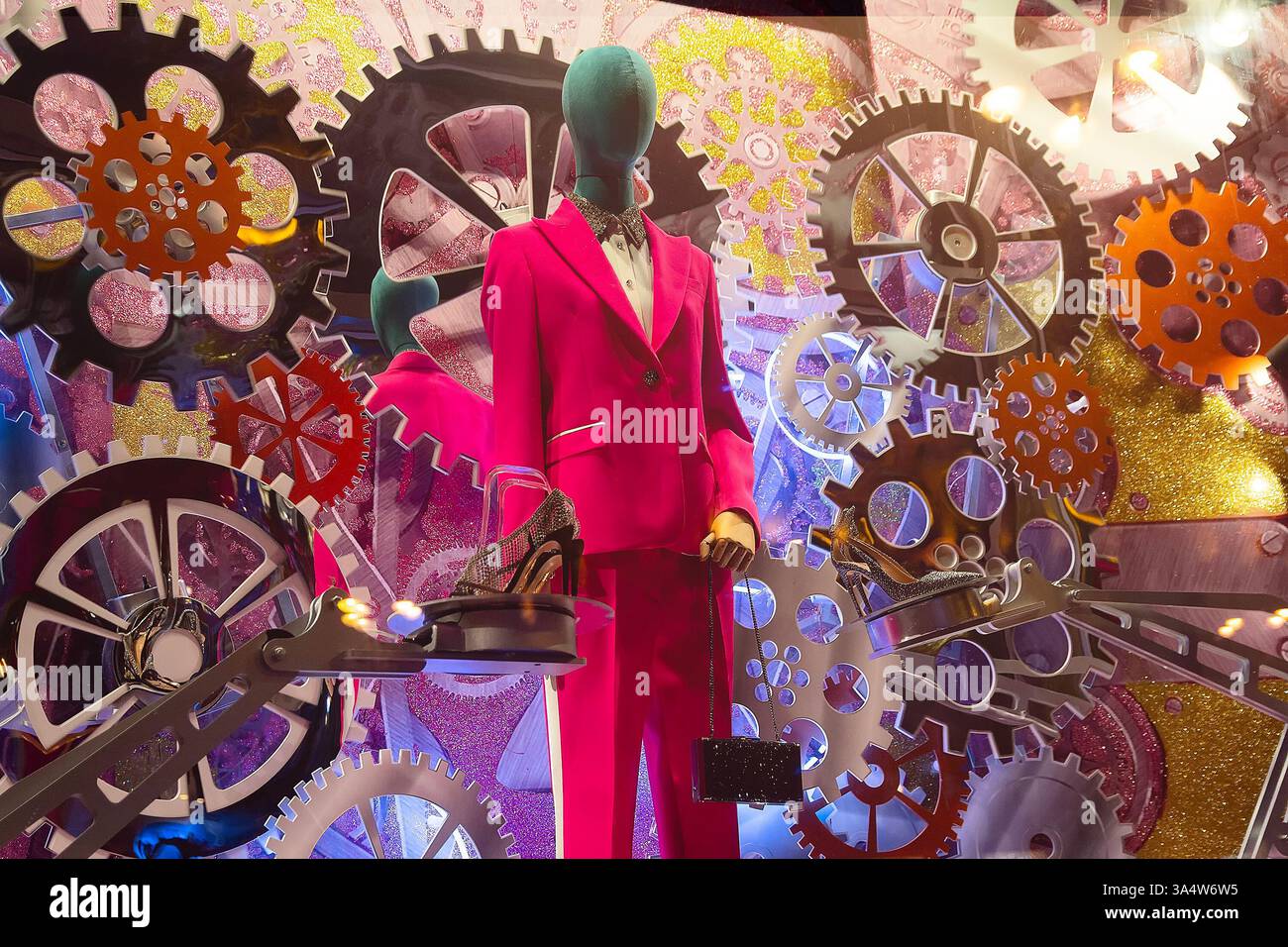 Female mannequin in an elegant suit in a showcase of original design ...