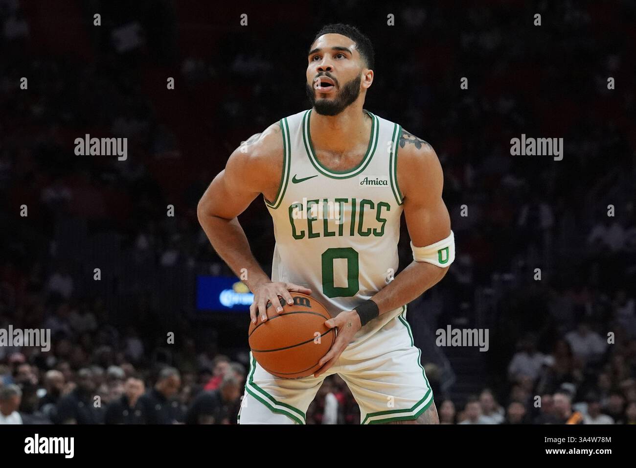 Boston Celtics forward Jayson Tatum (0) aims from the free throw line ...