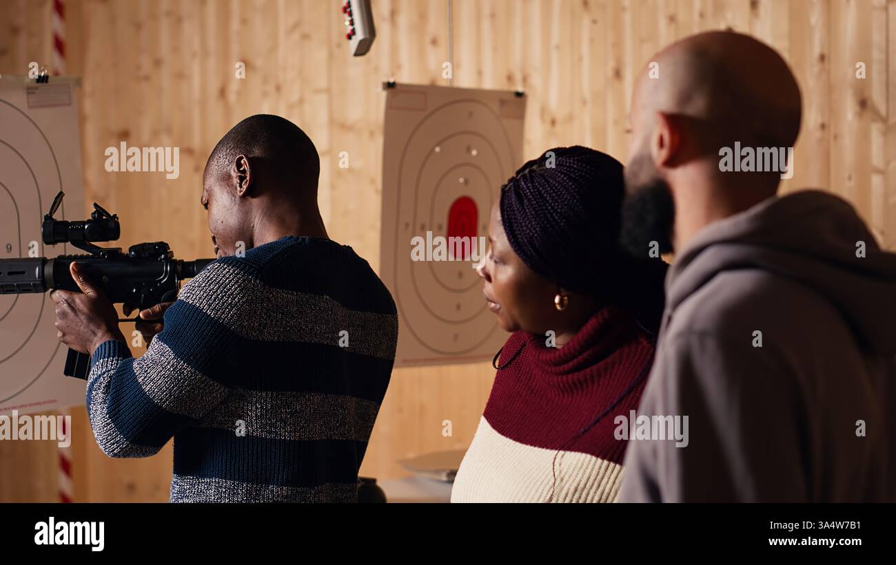 Shooting range safety officer demonstrating how to safely reload ...
