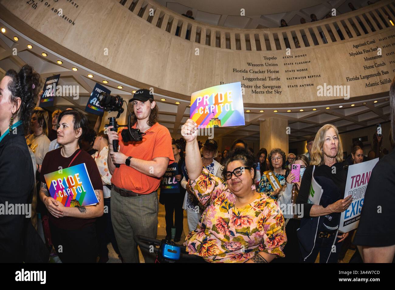 March 19, 2025, Tallahassee, Florida, USA: LGBTQ supporters raise signs ...