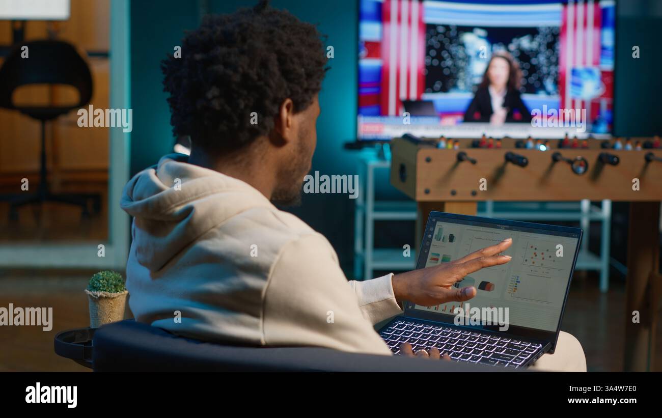 African american person working from home and checking statistical data ...