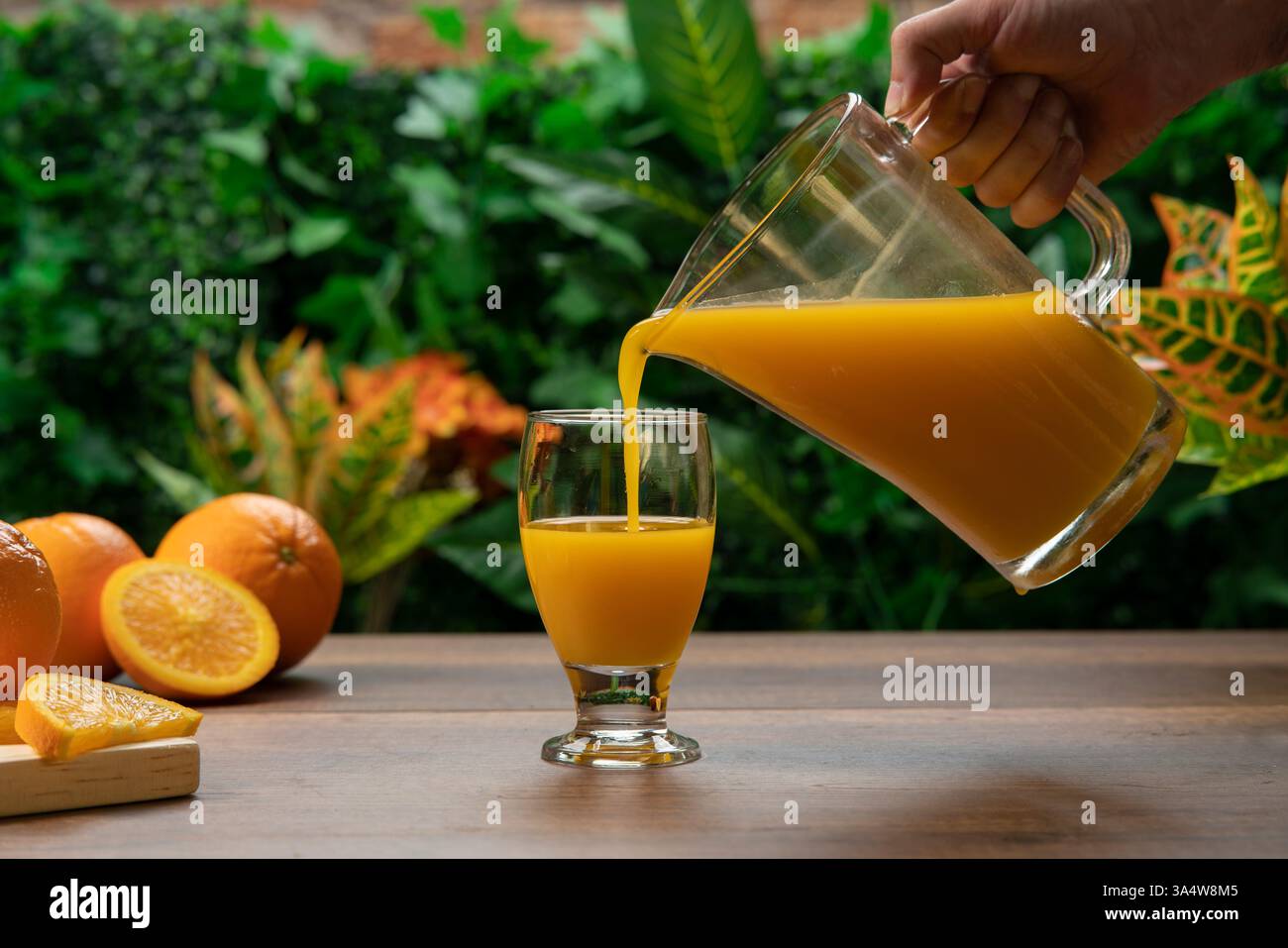 Glass jug filling orange juice hi-res stock photography and images - Alamy