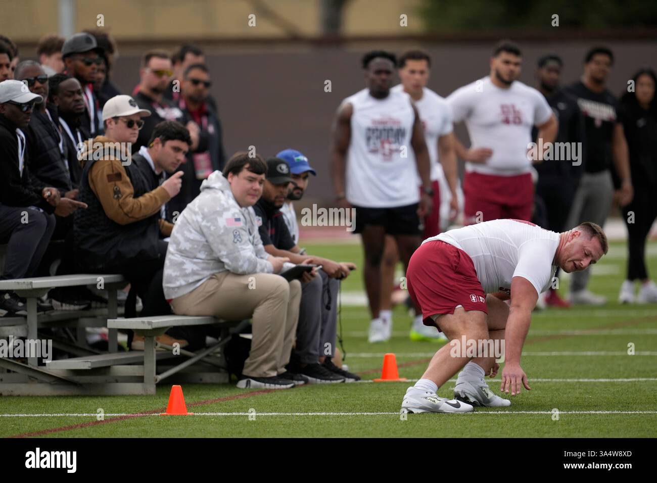 Offensive lineman Levi Rogers, bottom right, runs a drill in front of ...