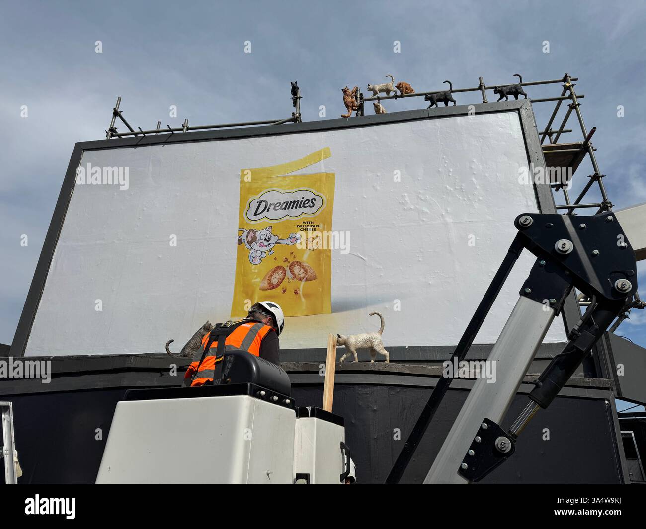 Billboard advert being installed in Shoreditch in London for Dreamies ...