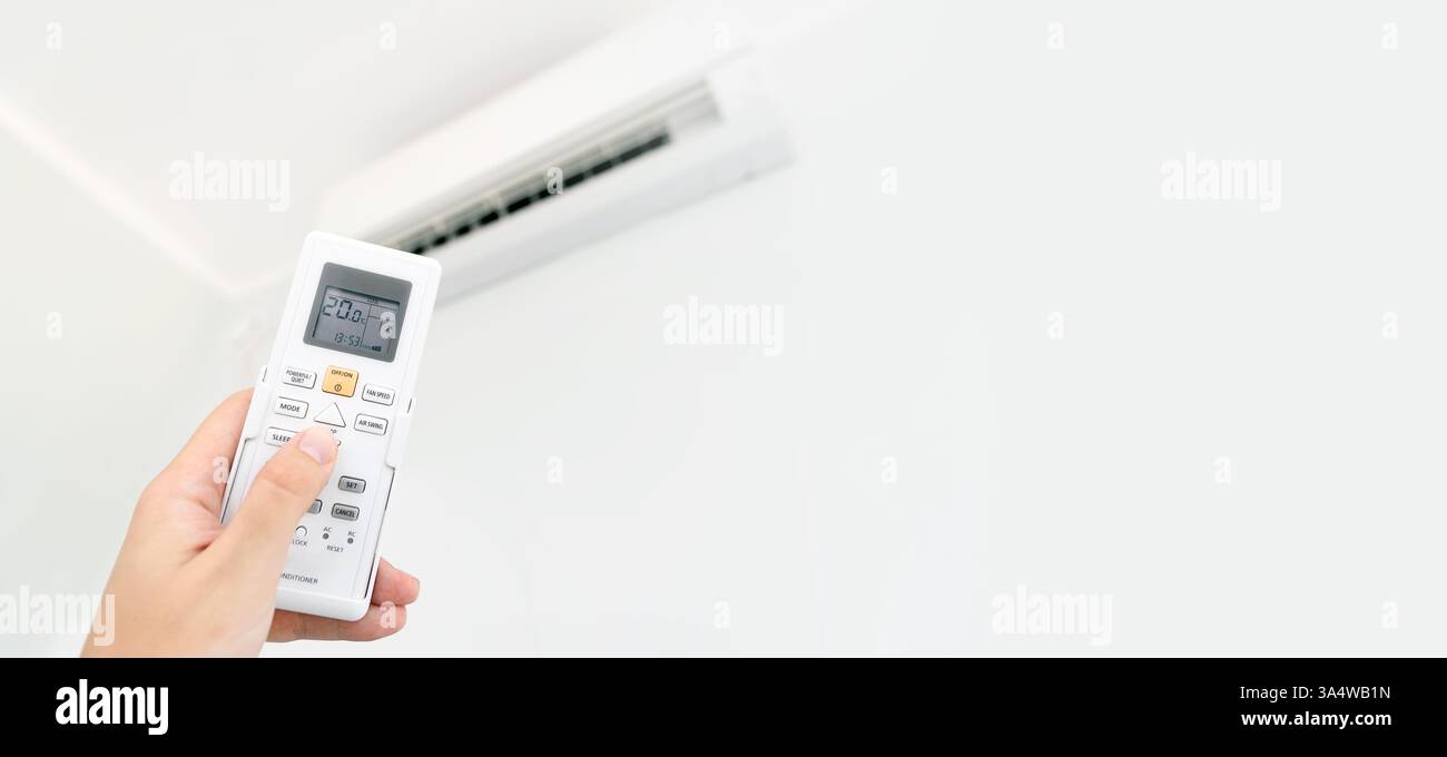 Air conditioner temperature adjustment with remote controller in room ...