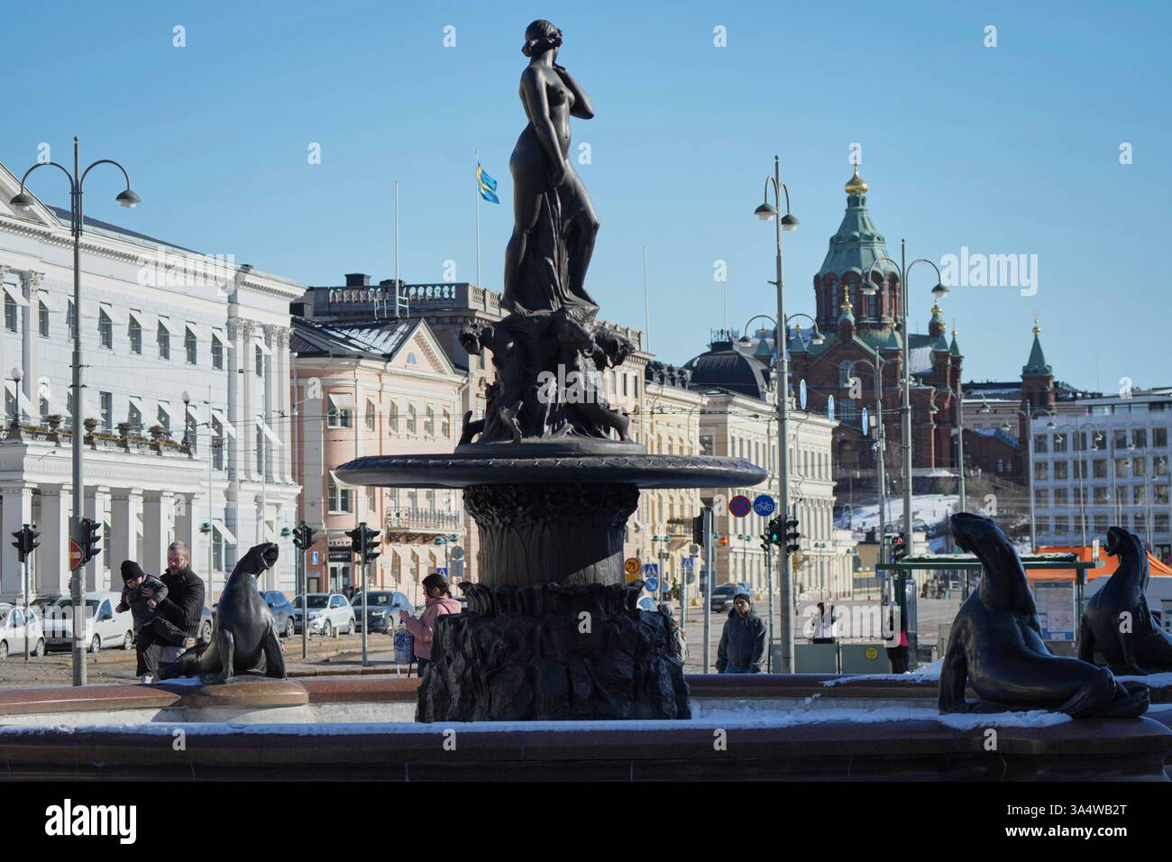 People walk next to the Havis Amanda statue on the Market Square in the ...