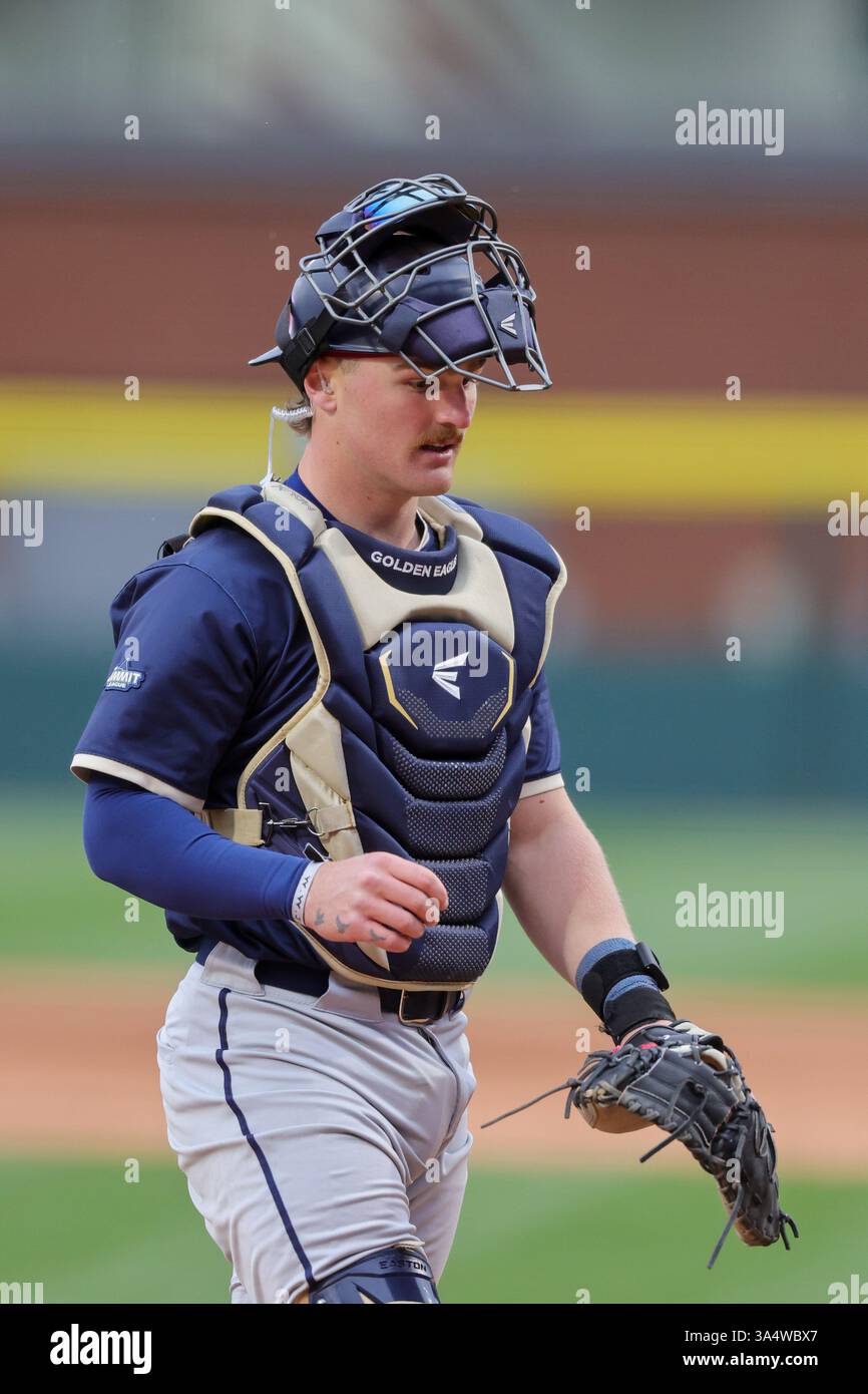 March 19, 2025: ORU catcher Matthew Mainord (37) lifts his mask as he ...