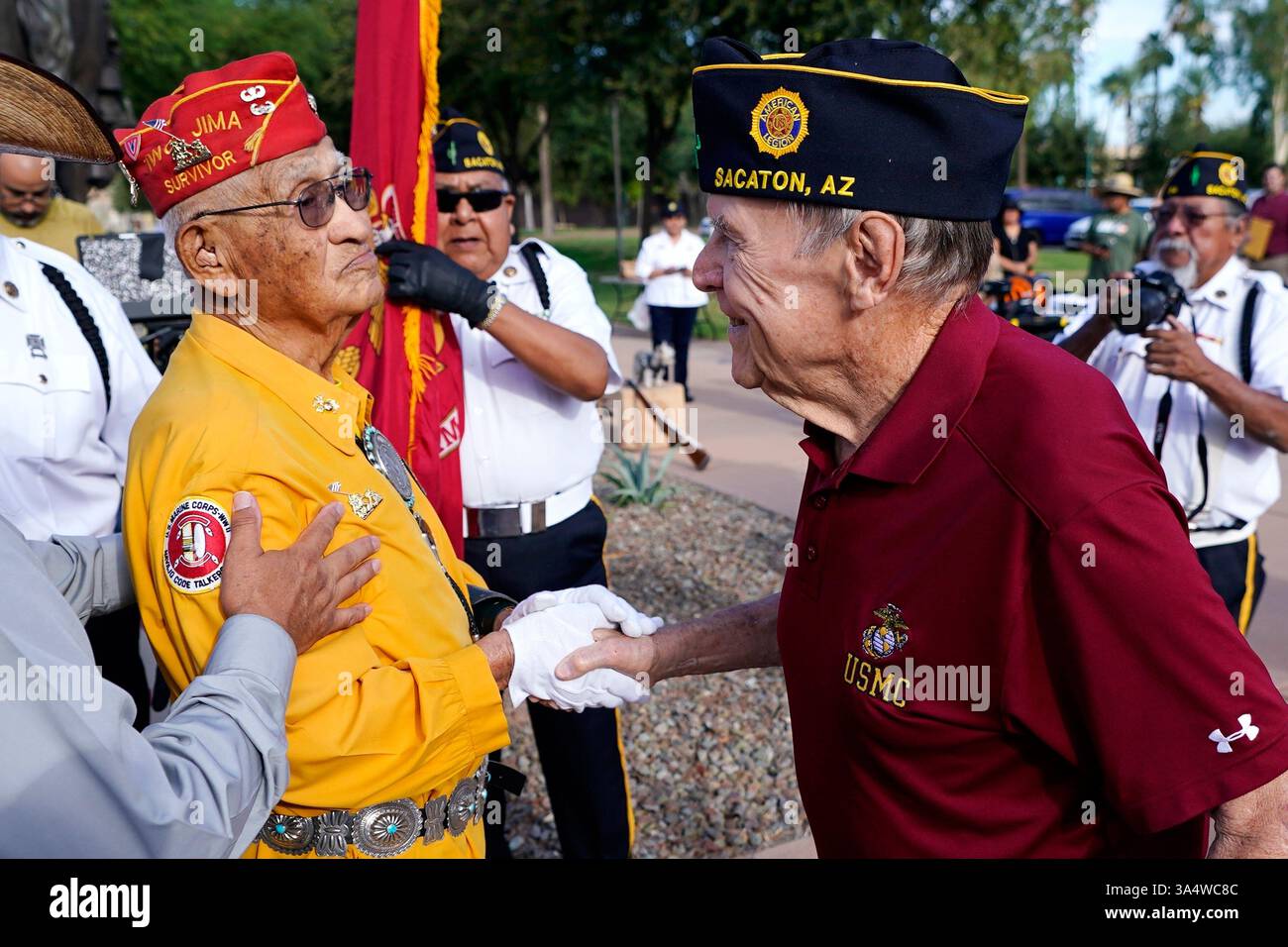 FILE - Navajo Code Talker Thomas Begay, left, shakes hands with Ron ...