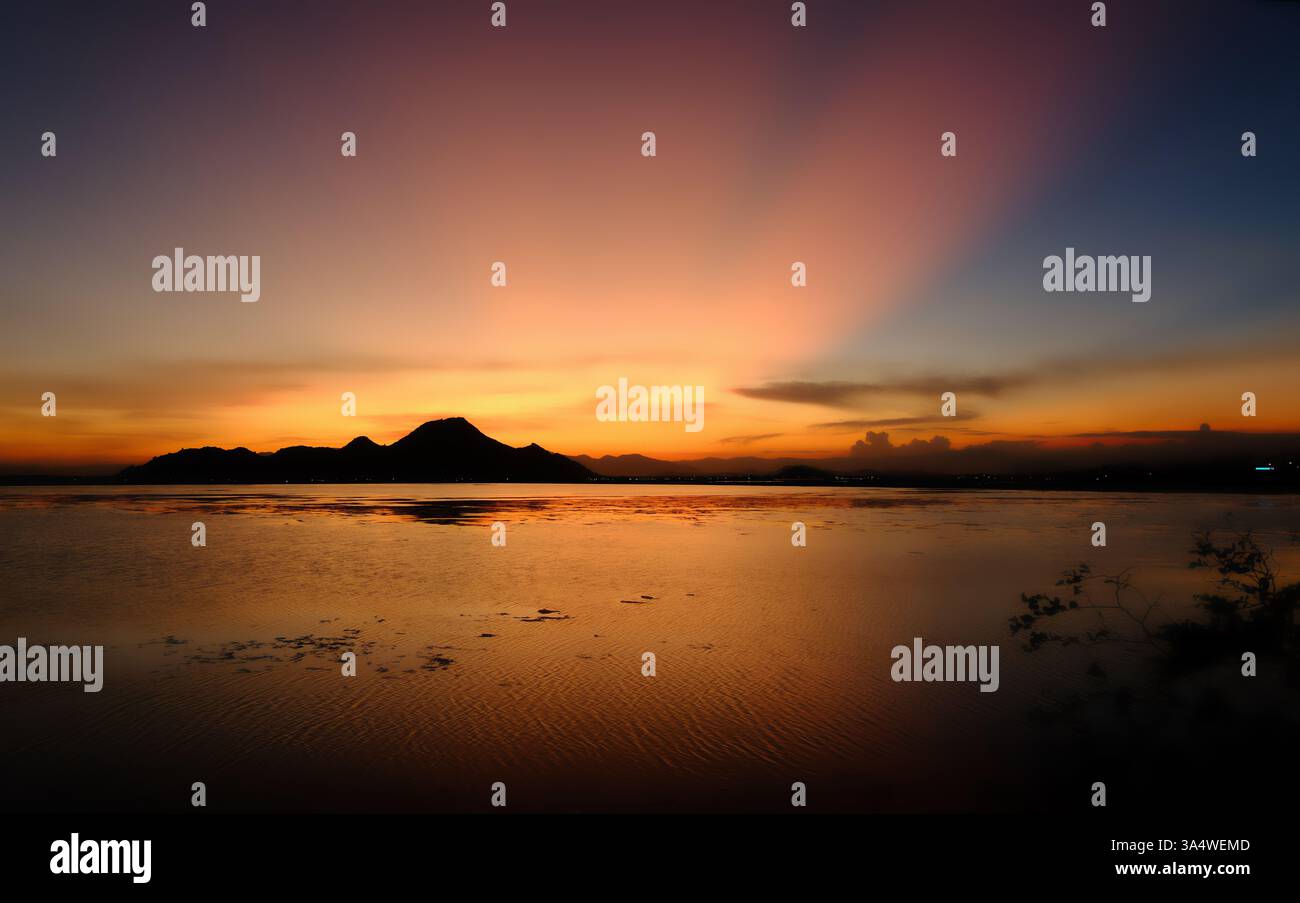 The fiery red sunset at the Central Vietnam coast, with the sea on one ...