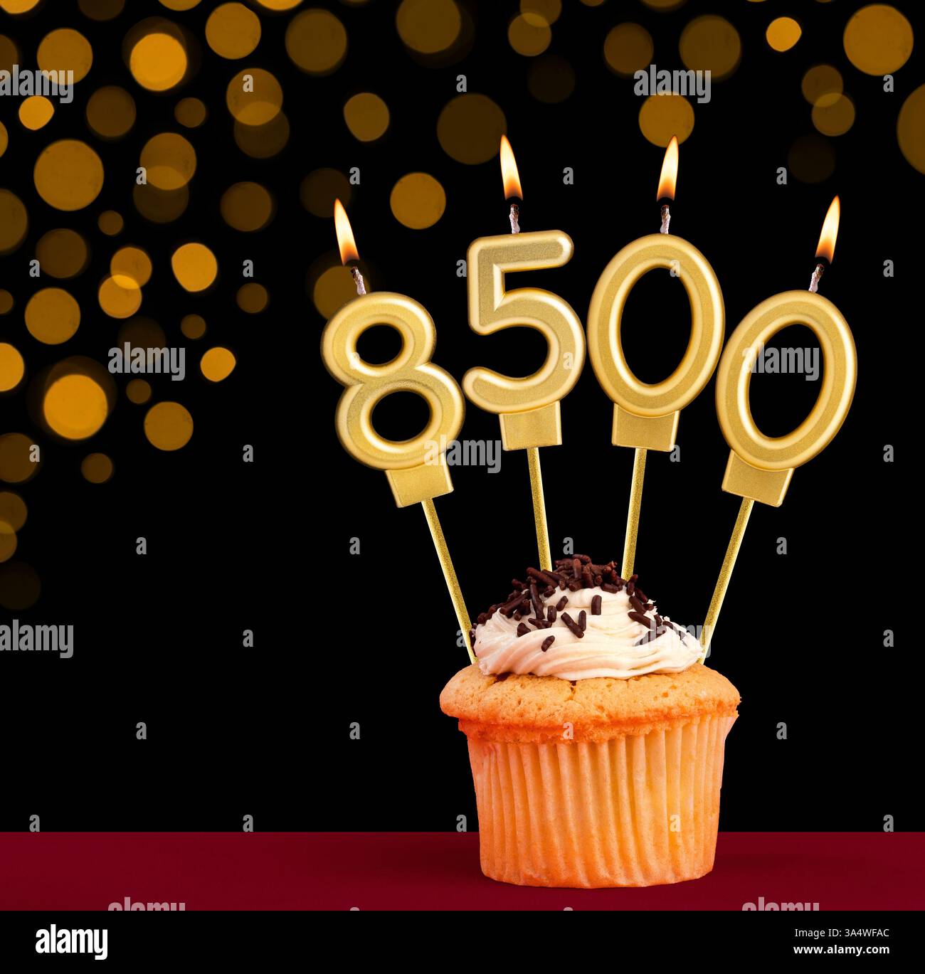 Birthday candle with cupcake - Number 8500 on black background with out ...