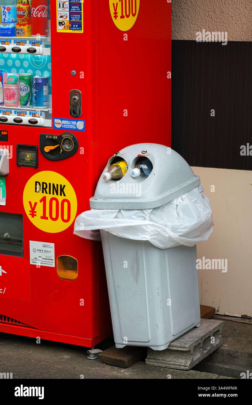 Osaka, Japan - Sep 21 2024, close up view of a trash can with beverage ...