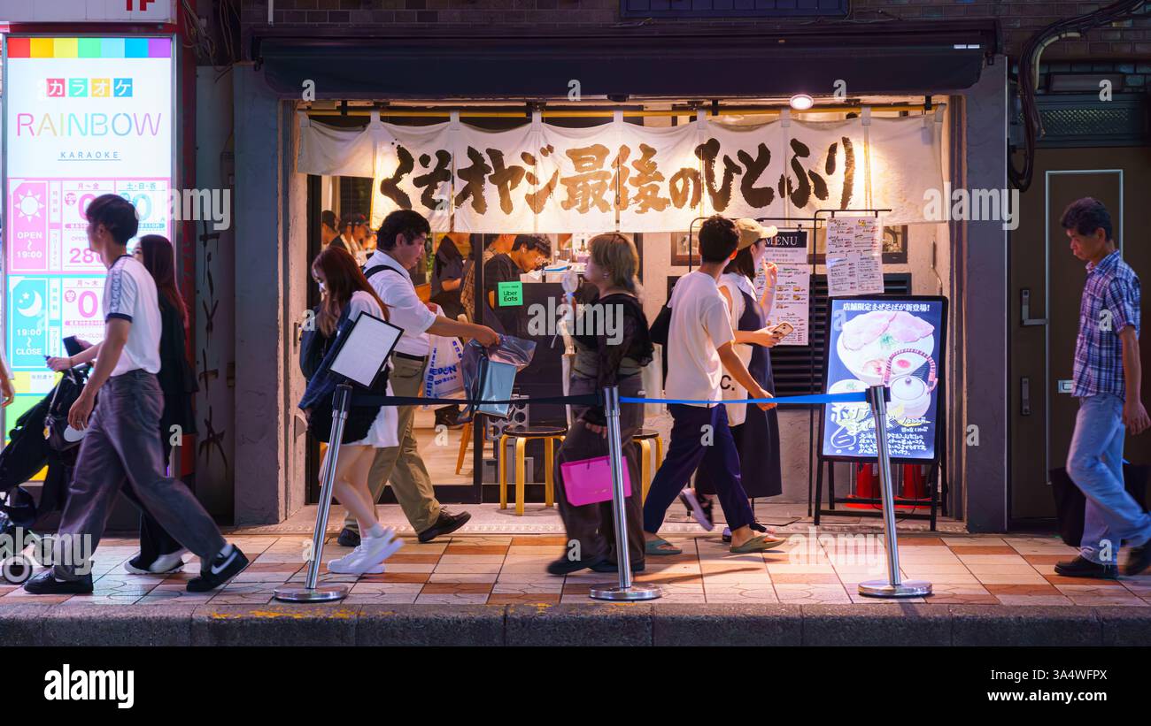 Osaka, Japan - Sep 21 2024, panoramic view of a group of people passing ...