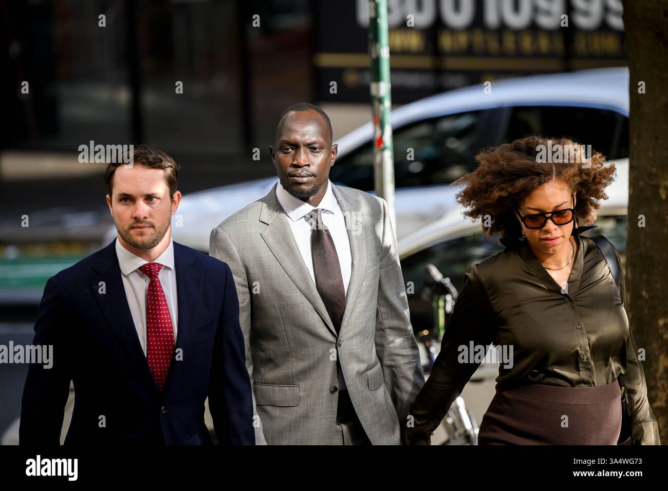 Sydney, Australia. 20th Mar, 2025. Ruon Tongyik (centre) arrives at the Downing Centre District ...