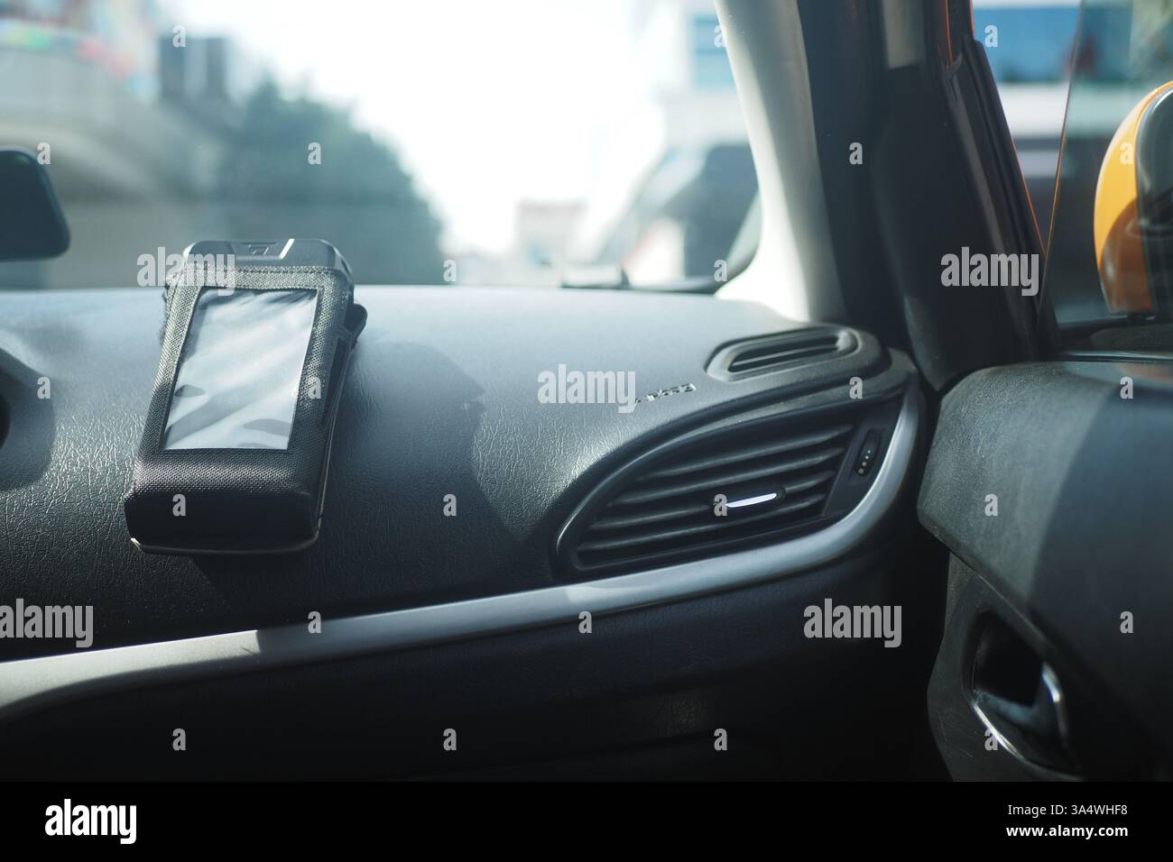Inside a car with pos machine on the dashboard Stock Photo - Alamy