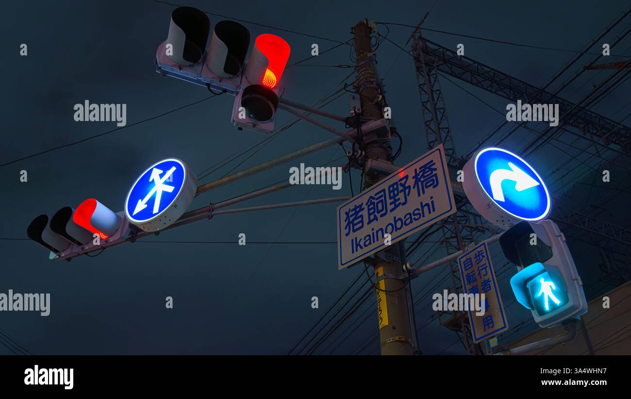 Osaka, Japan - Sep 22 2024, panoramic view from below of road signs ...