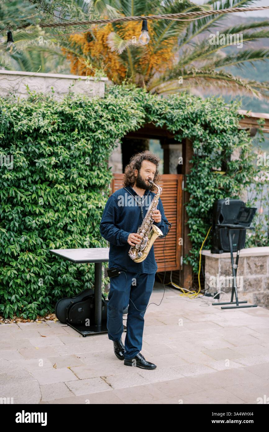 San Francisco, California, USA - May 21, 2024: Saxophonist plays the ...