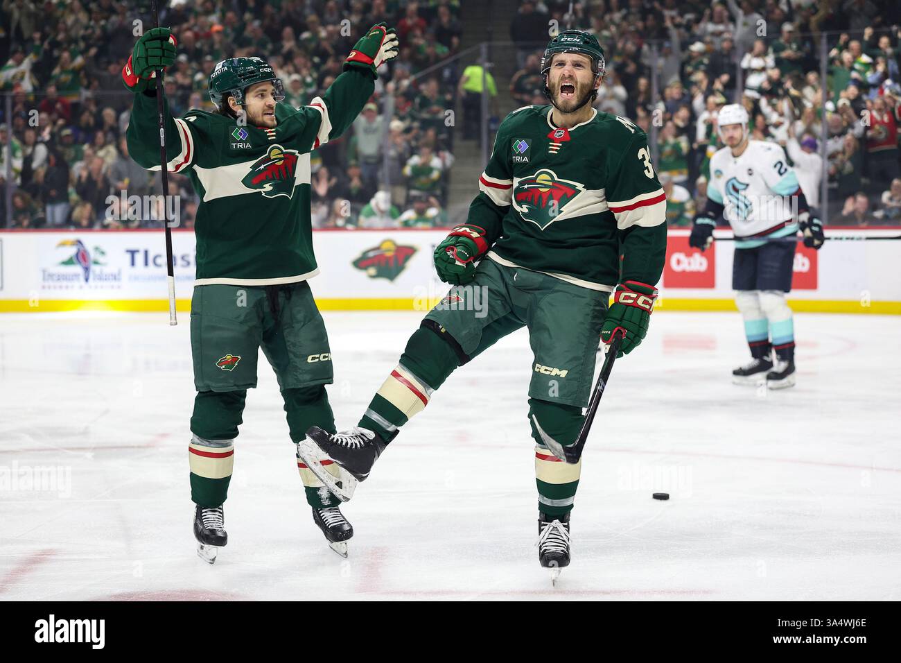 Minnesota Wild right wing Ryan Hartman, right, celebrates his goal ...