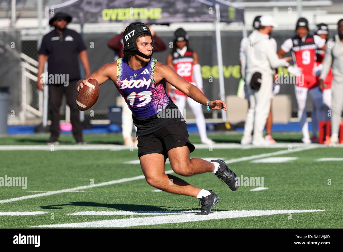 Midwest Boom quarterback Jonas Williams (13) drops back against RG3 ...