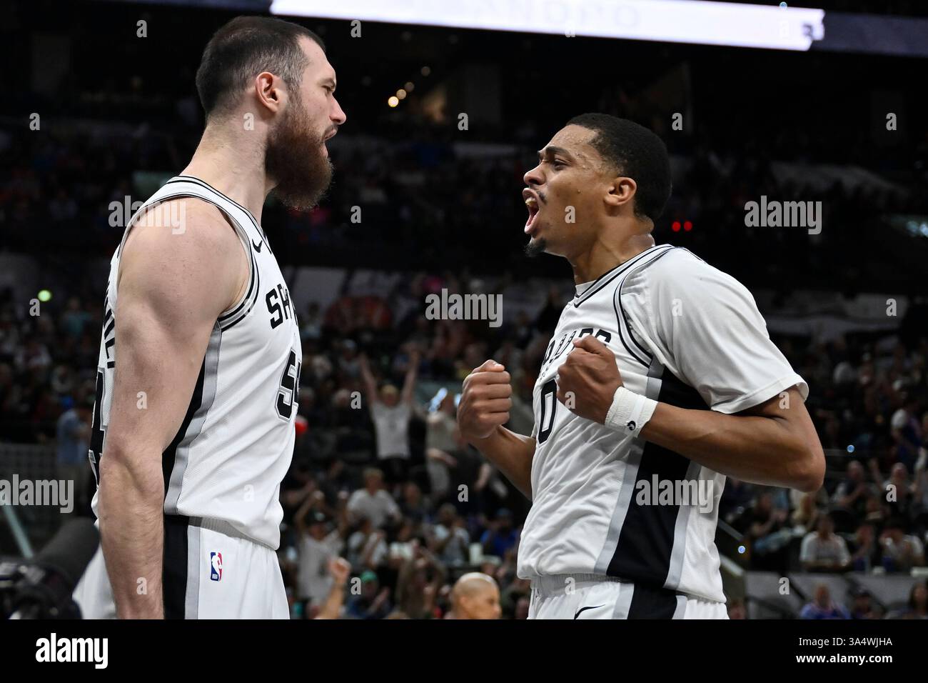 San Antonio Spurs forward Sandro Mamukelashvili, left, celebrates a ...