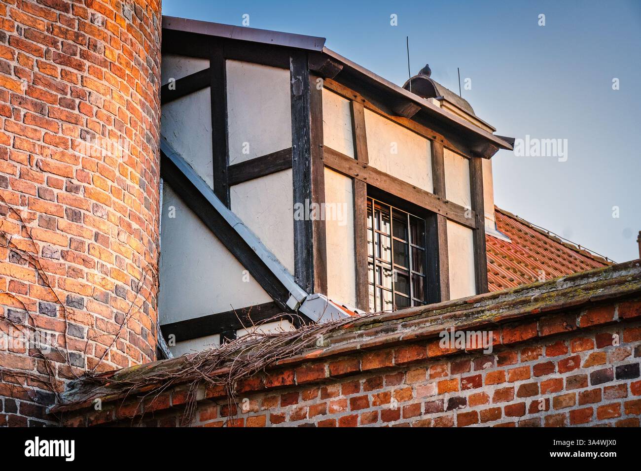 A charming view of a historic brick structure features wooden beams and ...