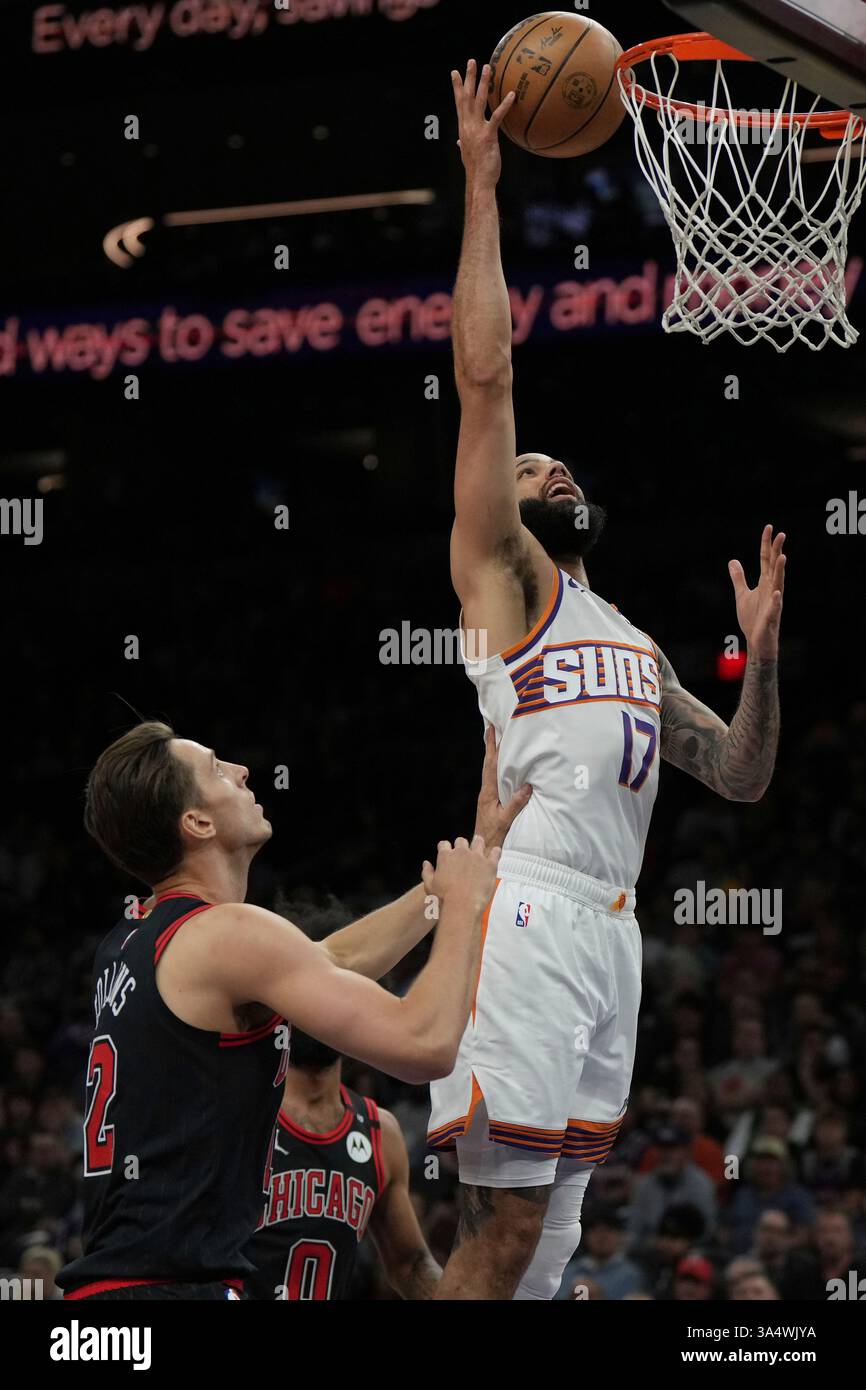 Phoenix Suns forward Cody Martin (17) shoots over Chicago Bulls forward ...