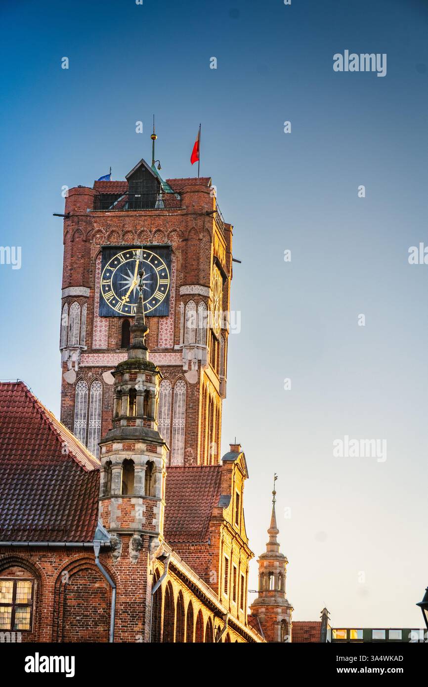 The majestic clock tower stands tall against the evening sky, its ...