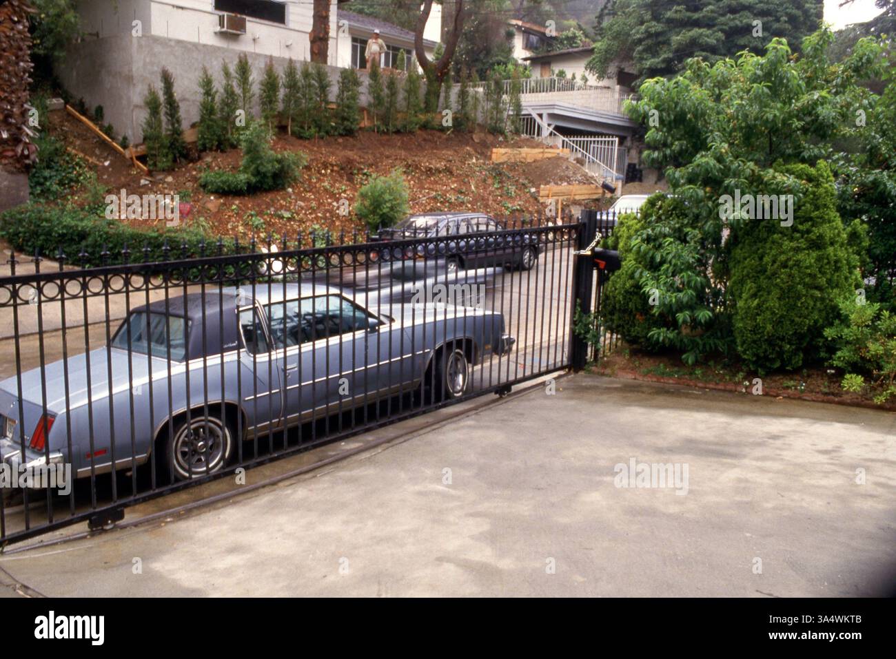 A car seen blocking the driveway of Peter Holm's and Joan Collins ...