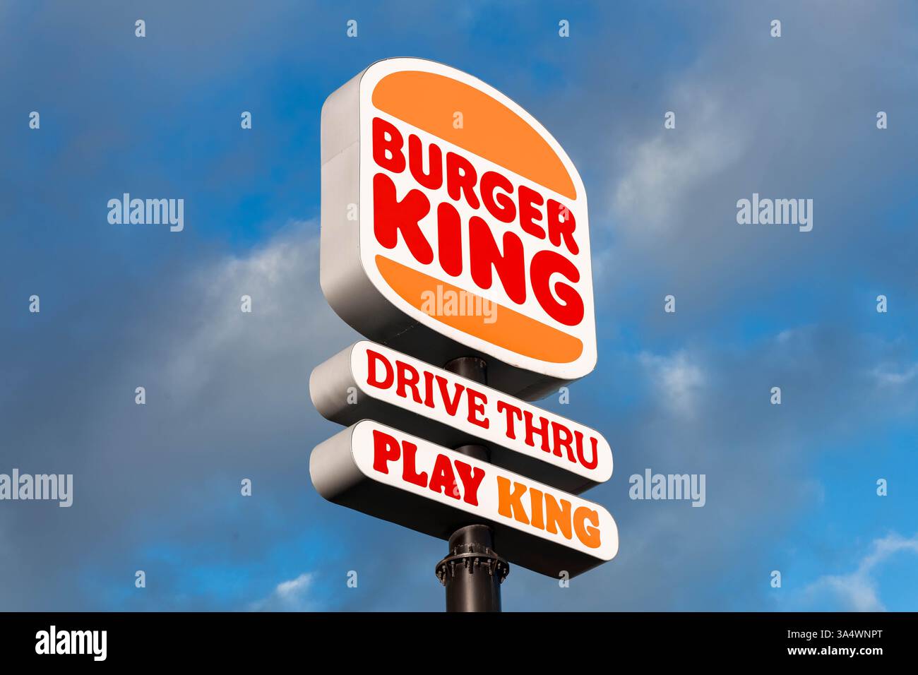 Burger King logo sign in the sky along a road, drive thru and play king ...