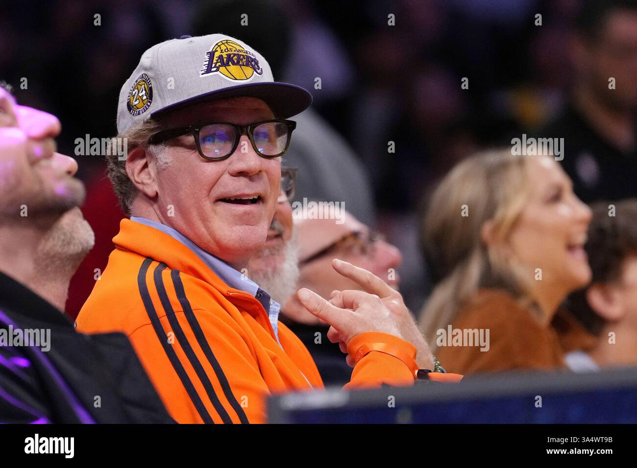 Actor Will Ferrell, left, mugs for the camera as actress Kate Hudson ...