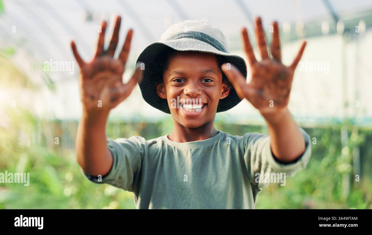 Portrait, dirty hands and black child in garden, palms and nature with ...