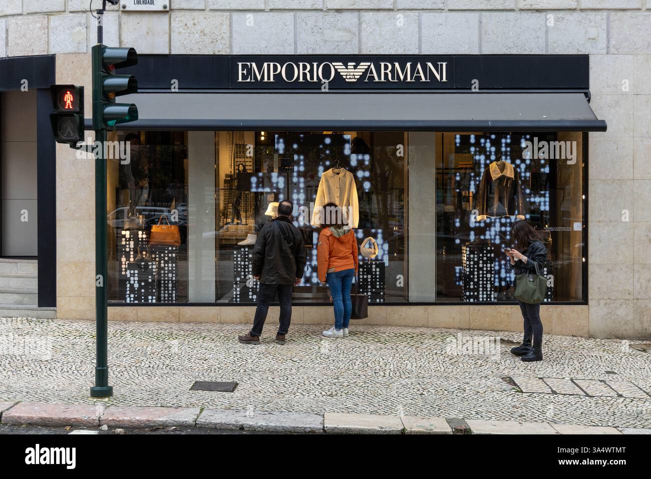 Emporio Armani logo sign at the shop. Giorgio Armani is an ...