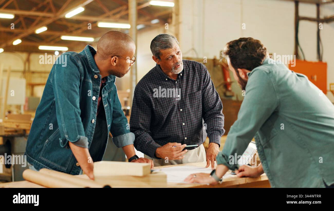 Carpentry, teamwork and men in workshop for woodwork on furniture ...