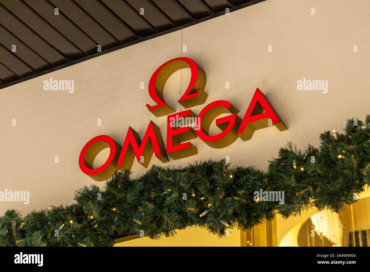 Omega logo sign at the watch shop. Omega SA is a Swiss luxury ...