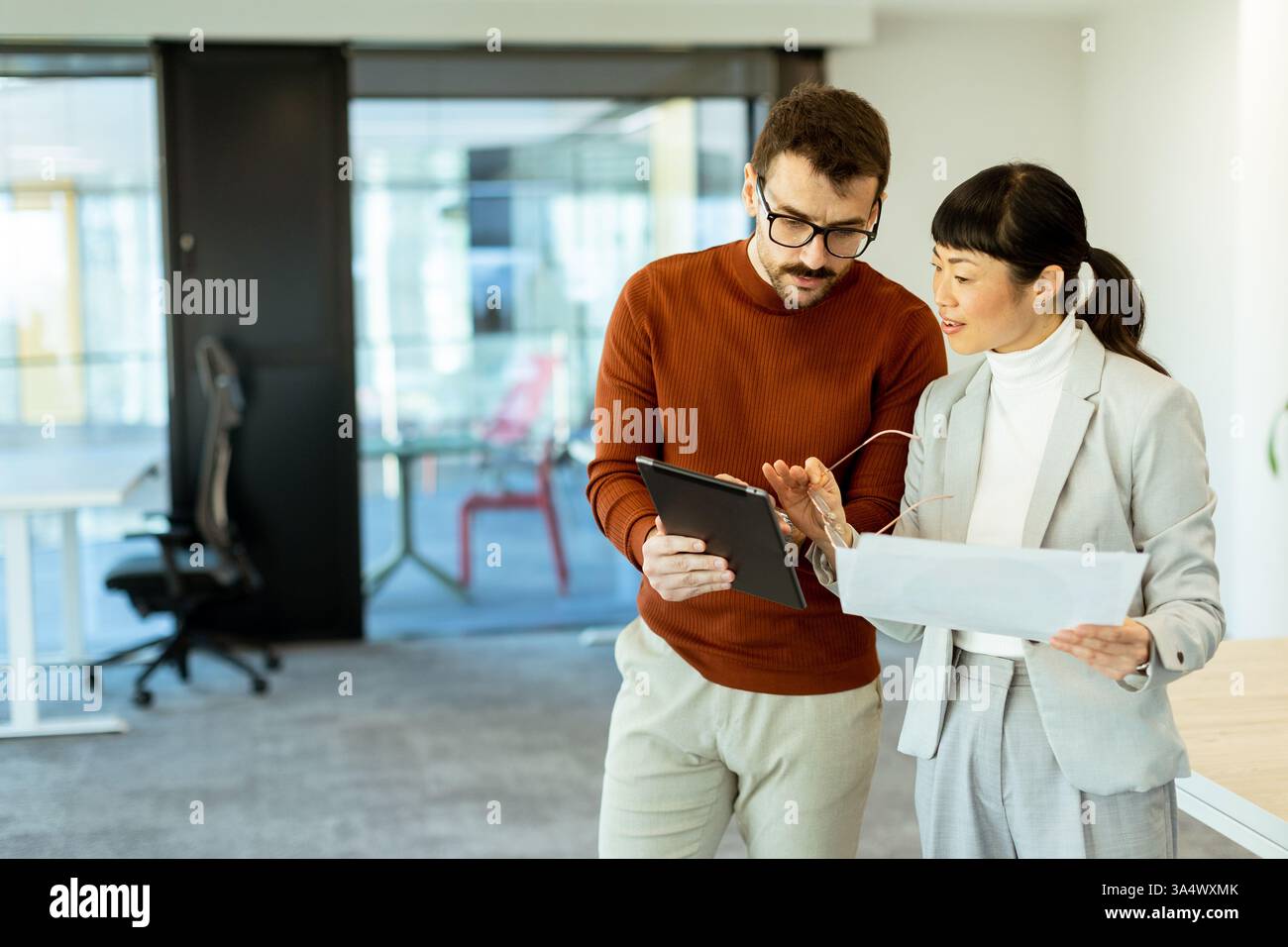 Office colleagues engage in productive hi-res stock photography and ...