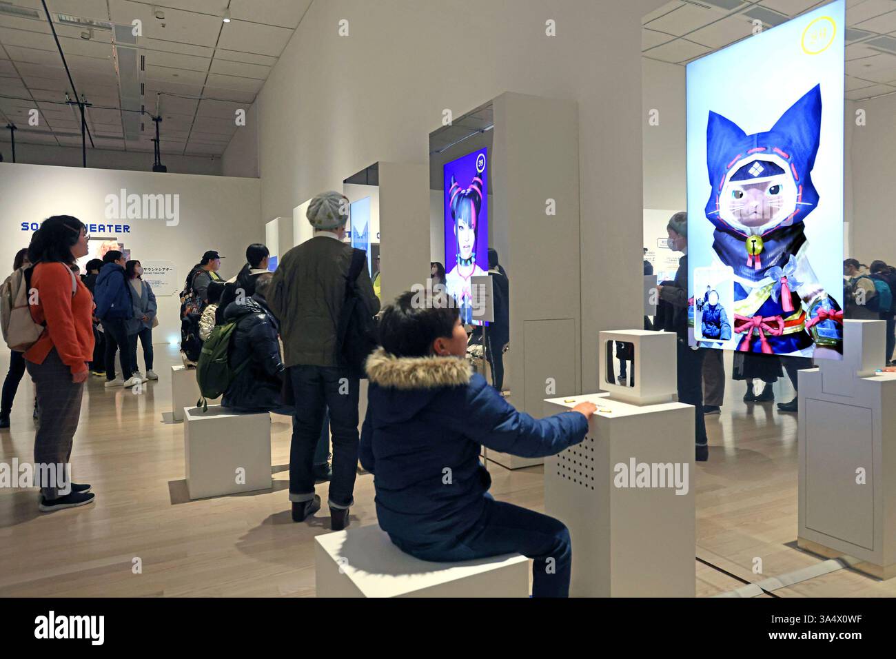 Visitors enjoy the facial tracking mirror of "Capcom Creation –moving ...