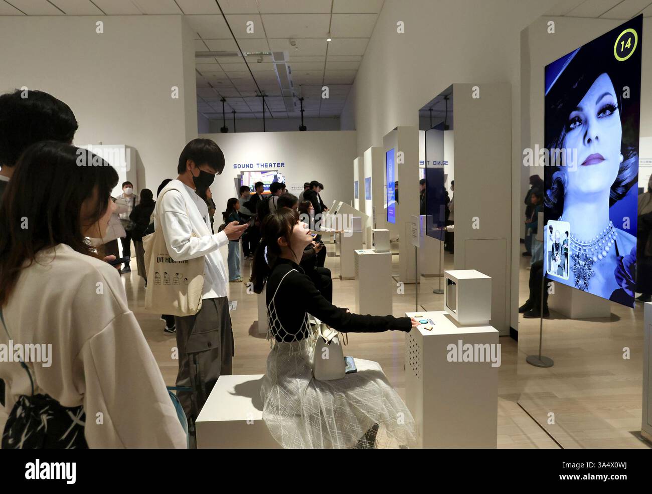 Visitors enjoy the facial tracking mirror of "Capcom Creation –moving ...