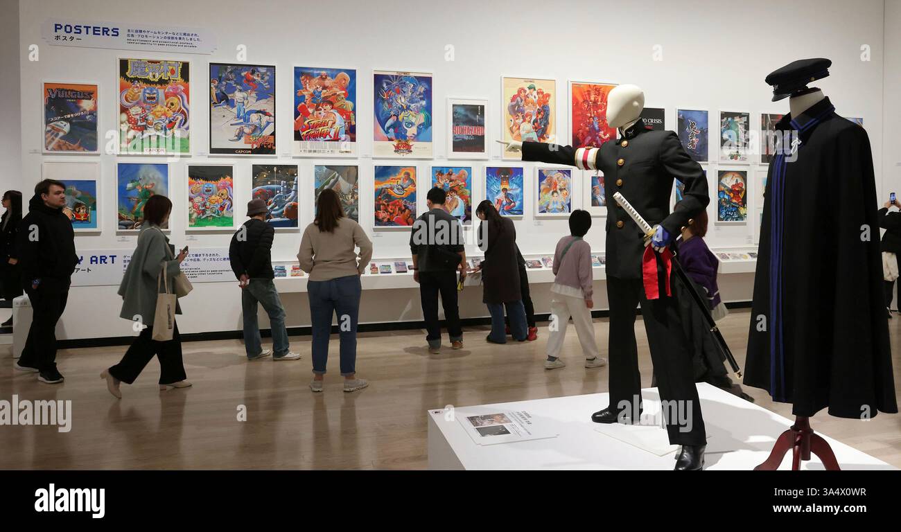Visitors gaze the poster's main art of "Capcom Creation –moving hearts ...