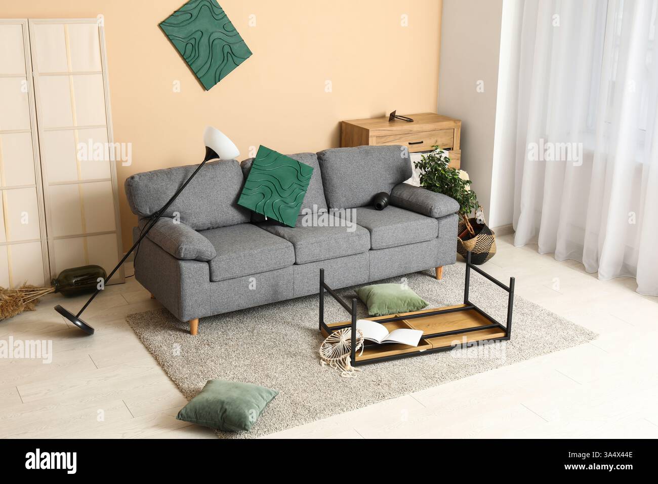 Interior of ruined living room with sofa after earthquake Stock Photo ...
