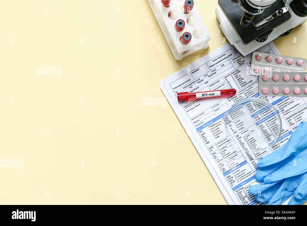 HIV blood test tubes, pills and laboratory report form on yellow ...