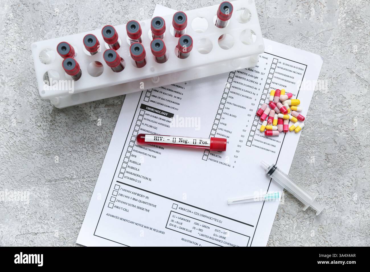 HIV blood test tubes, laboratory report form and pills on grey grunge ...