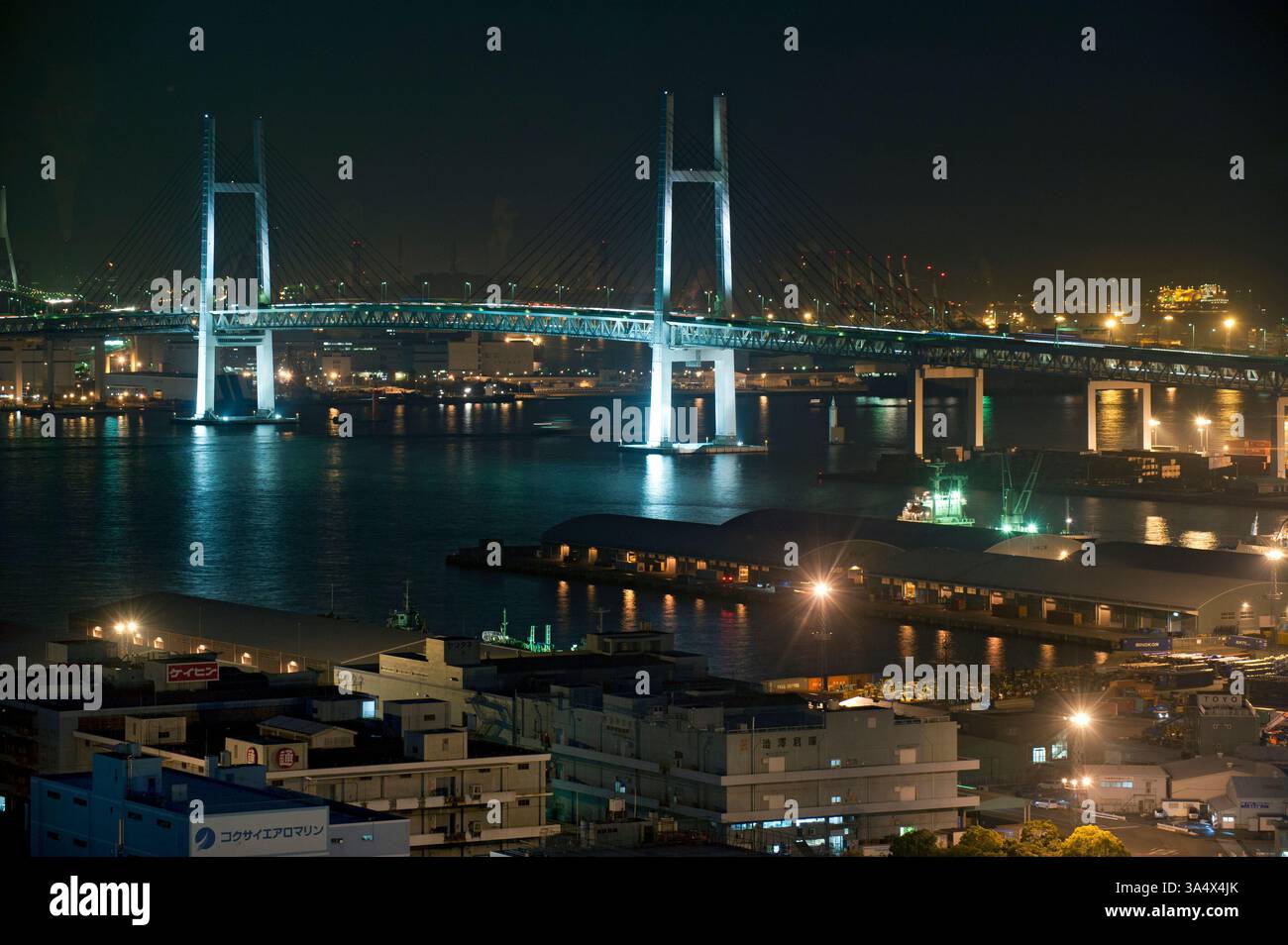 Aerial view of Yokohama Bay Bridge and Yokohama's industrial port area ...