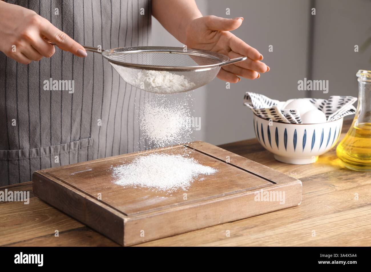 Housewife woman sifting flour hi-res stock photography and images - Alamy