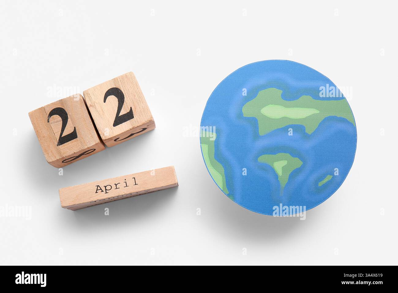 Paper planet Earth and calendar with date 22 APRIL on white background ...