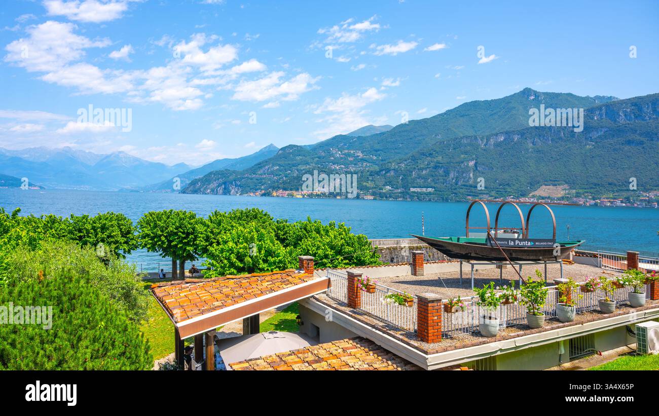 A bright sunny day at Lake Como features lush green trees and ...