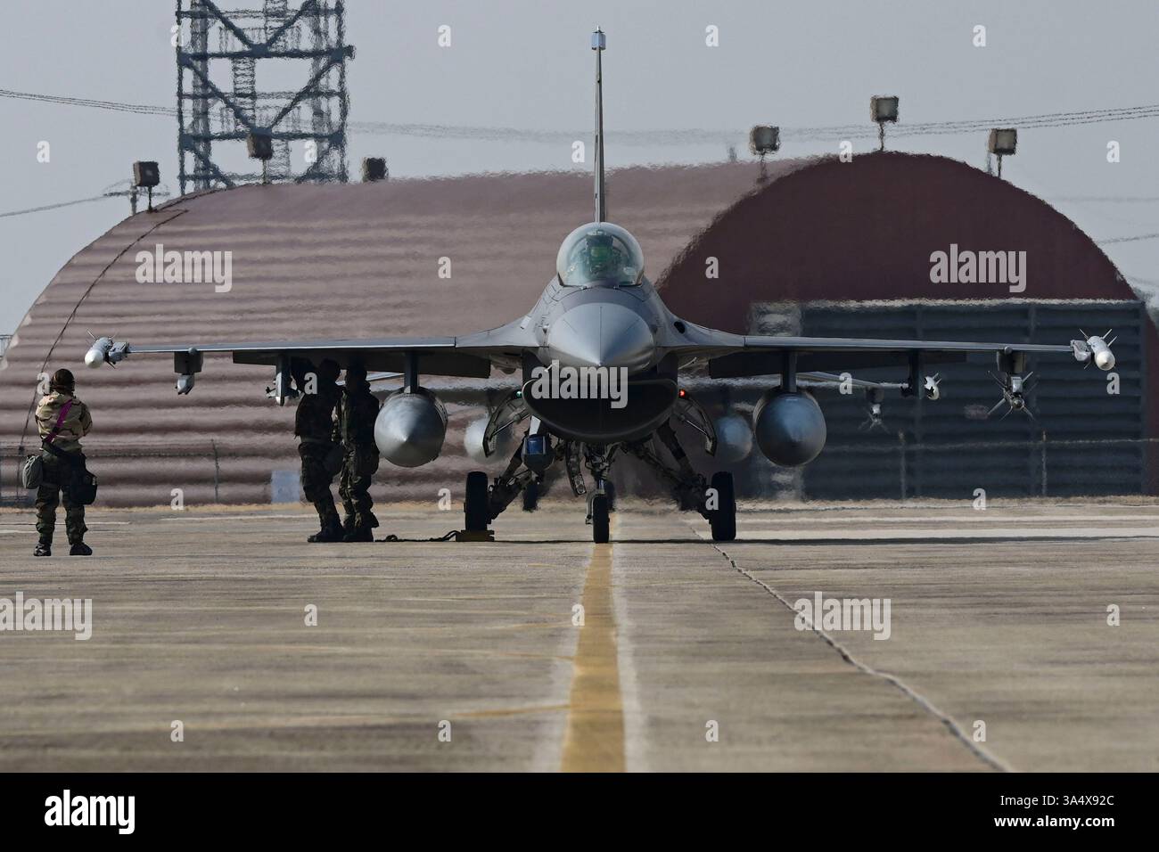 F-16 Fighting Falcons are inspected prior to an integrated combat turn ...